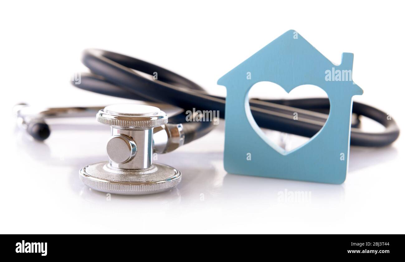Concept of family medicine - blue plastic house with heart shaped ...