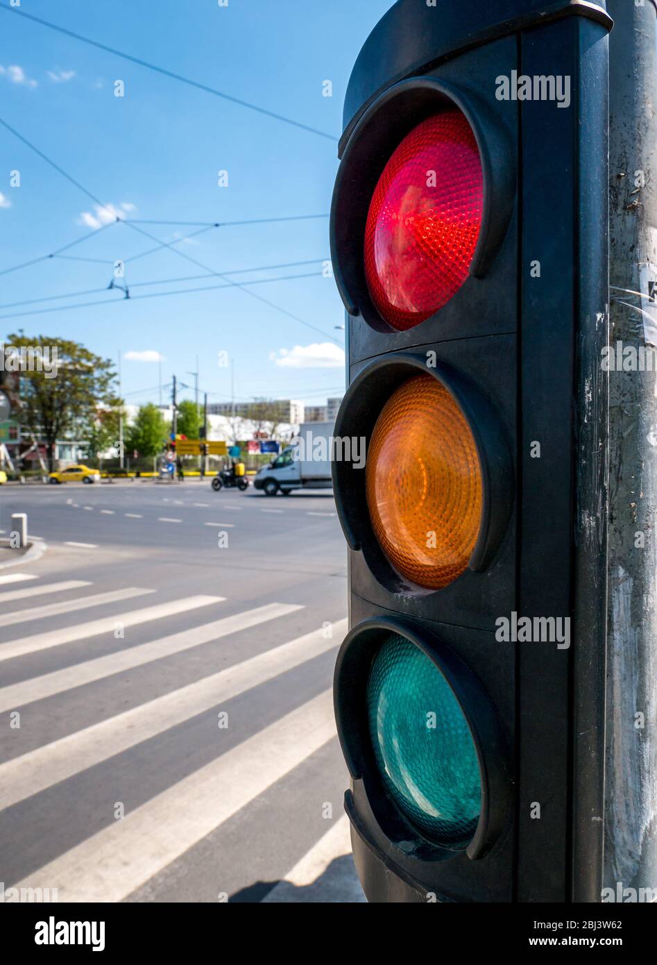 A city crossing with a semaphore indicating red light. traffic light ...