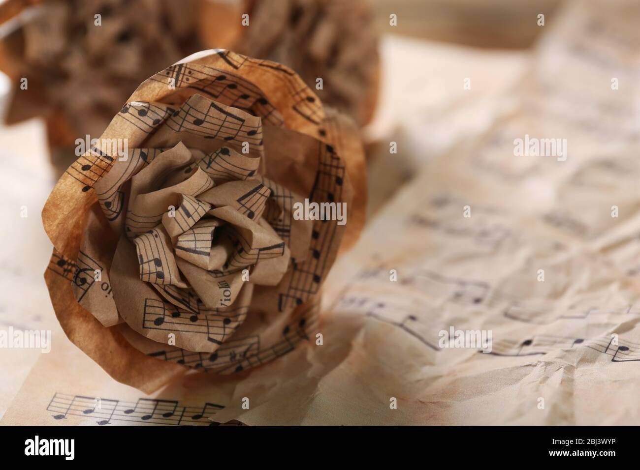 Beautiful paper-made roses on musical notes page background Stock Photo ...