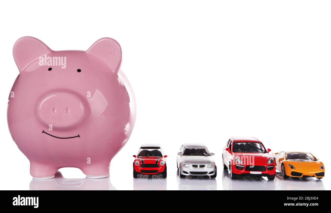 Pig moneybox and toy cars isolated on white Stock Photo - Alamy