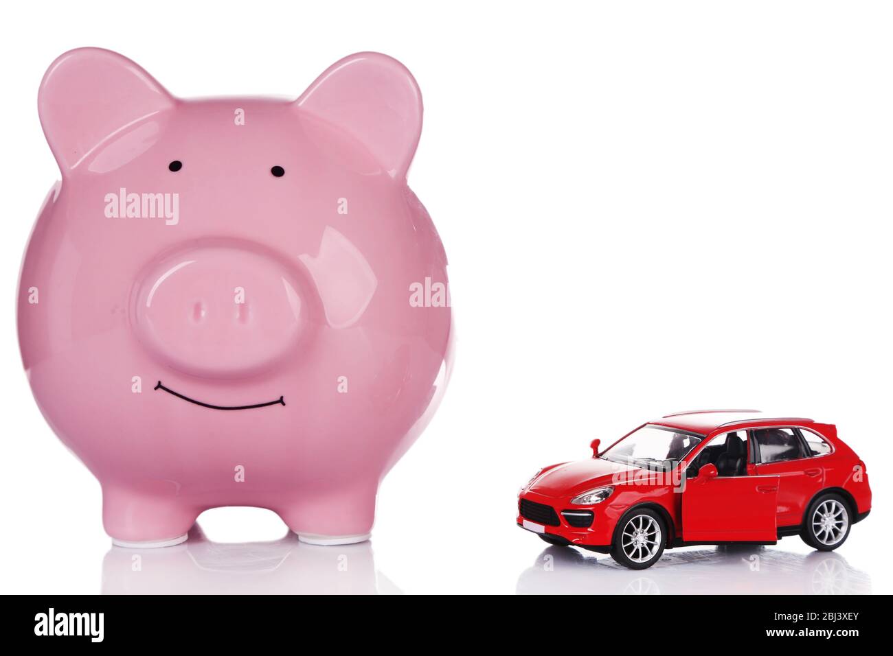 Pig moneybox and toy car isolated on white Stock Photo - Alamy
