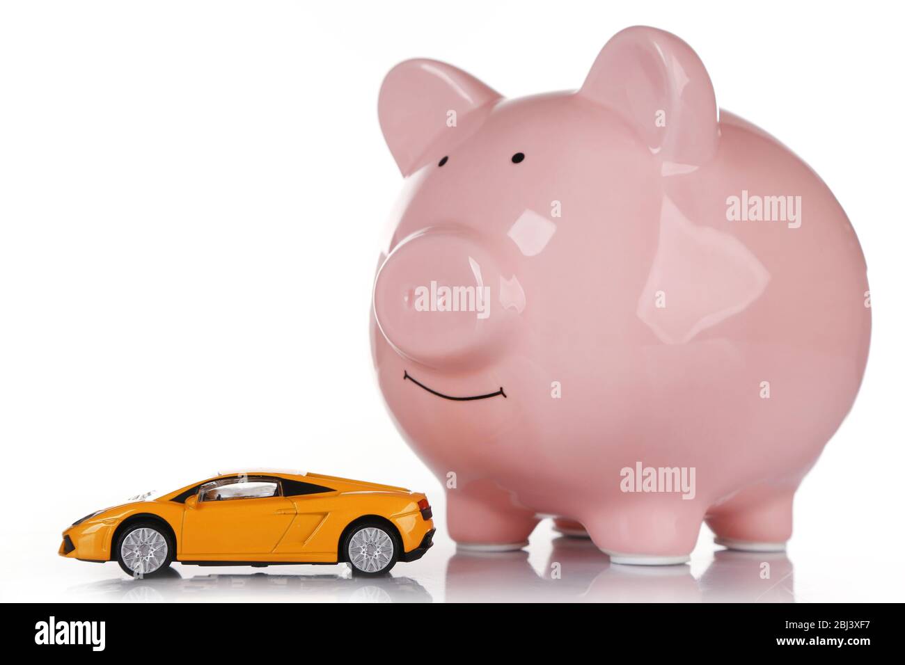 Pig moneybox and toy car isolated on white Stock Photo - Alamy