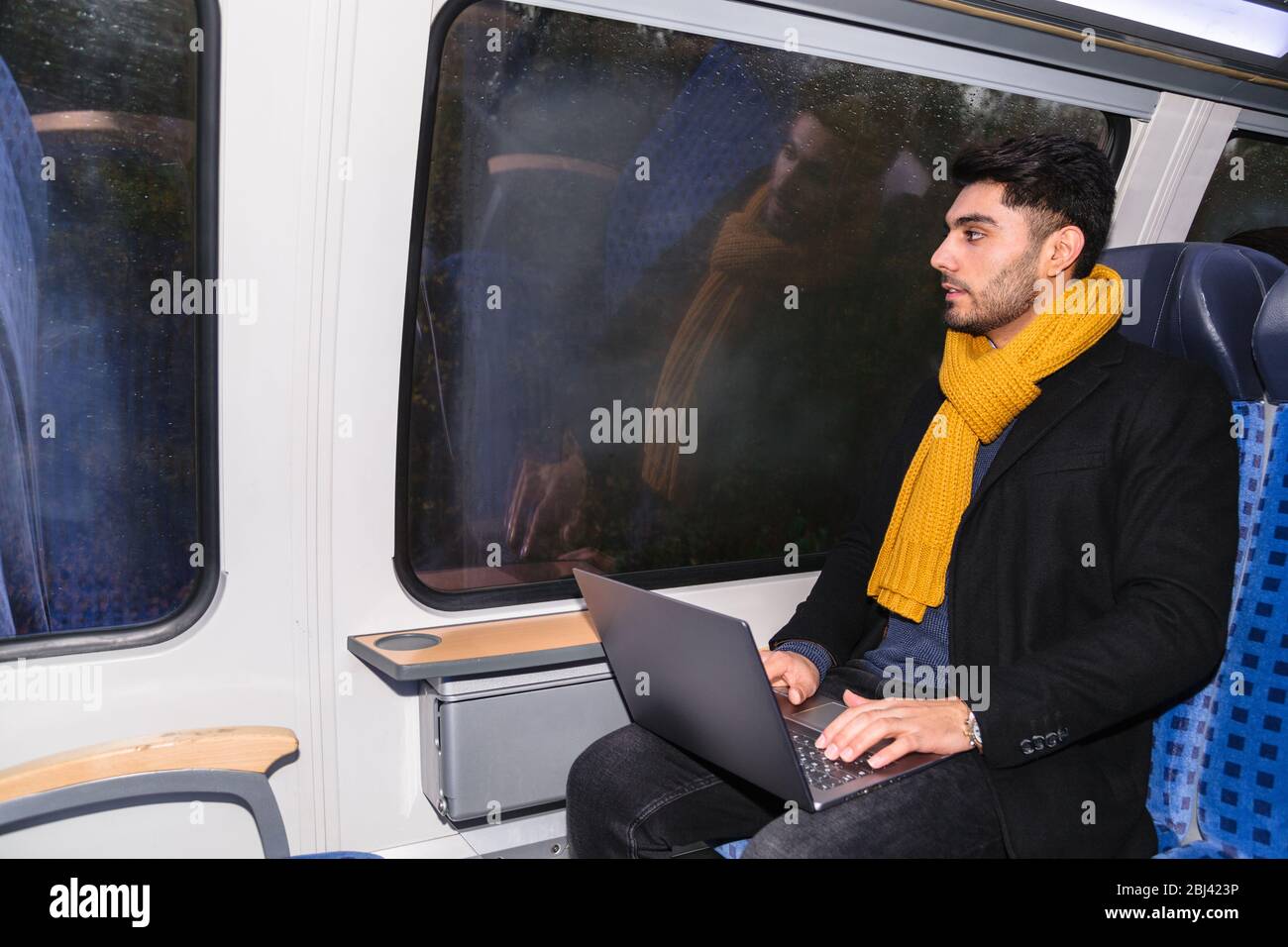 Young man commuter train hi-res stock photography and images - Alamy