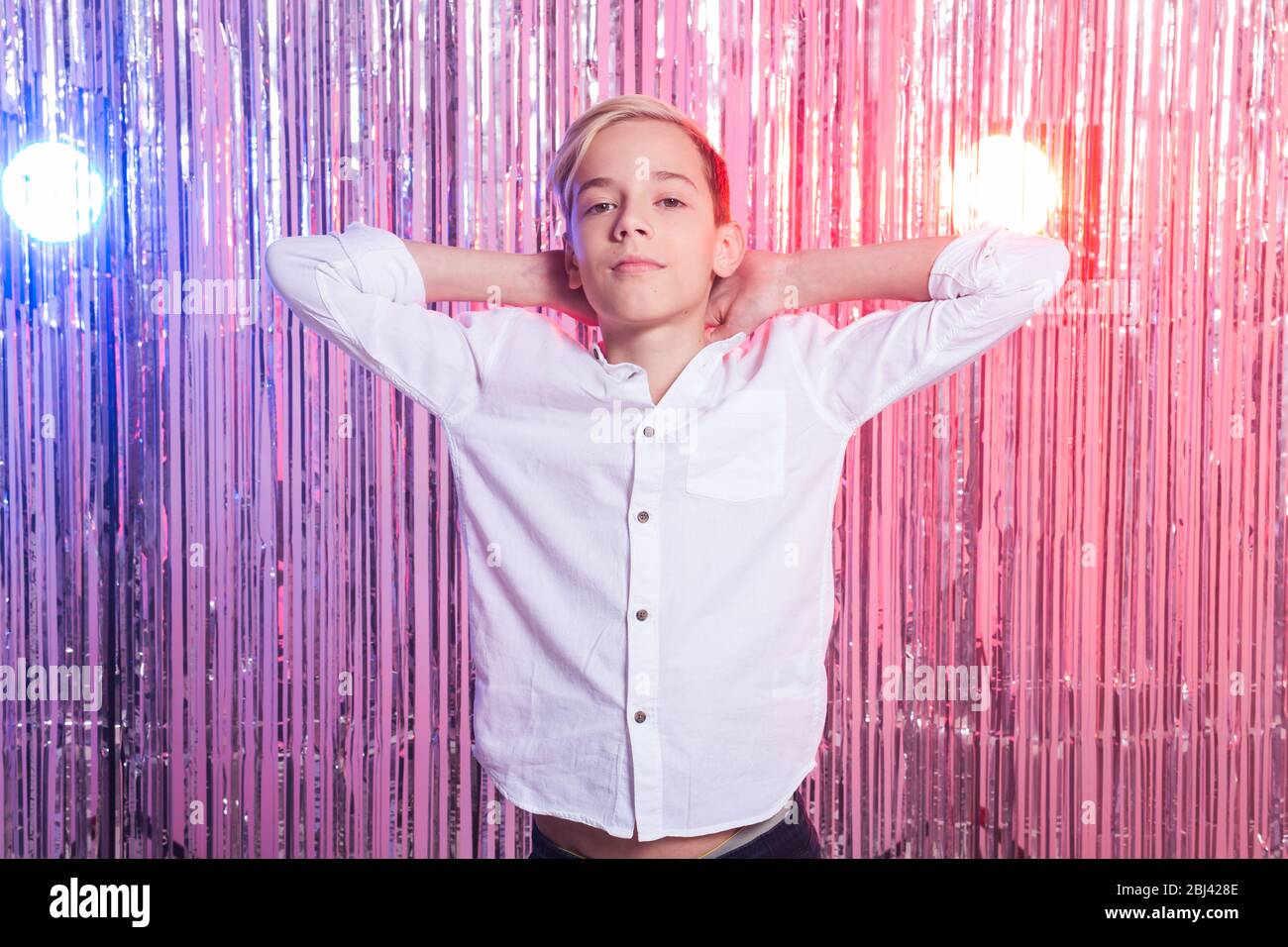 Awkward age and teenage concept - Portrait of teen boy at a party ...