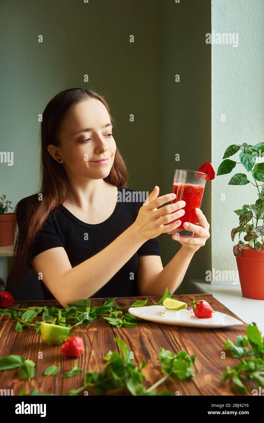 Woman Hand Holding Smoothie Shake Smiling Girl Happy At Home And Drinking Red Healthy Smoothie