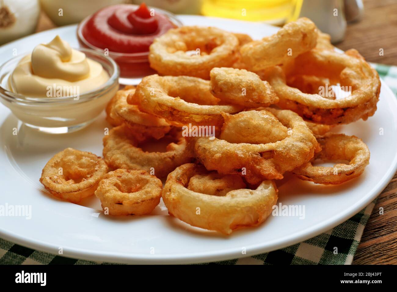 Chips rings with sauce on plate Stock Photo - Alamy