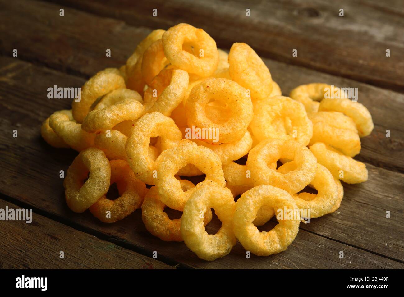 Chips rings on wooden background Stock Photo - Alamy