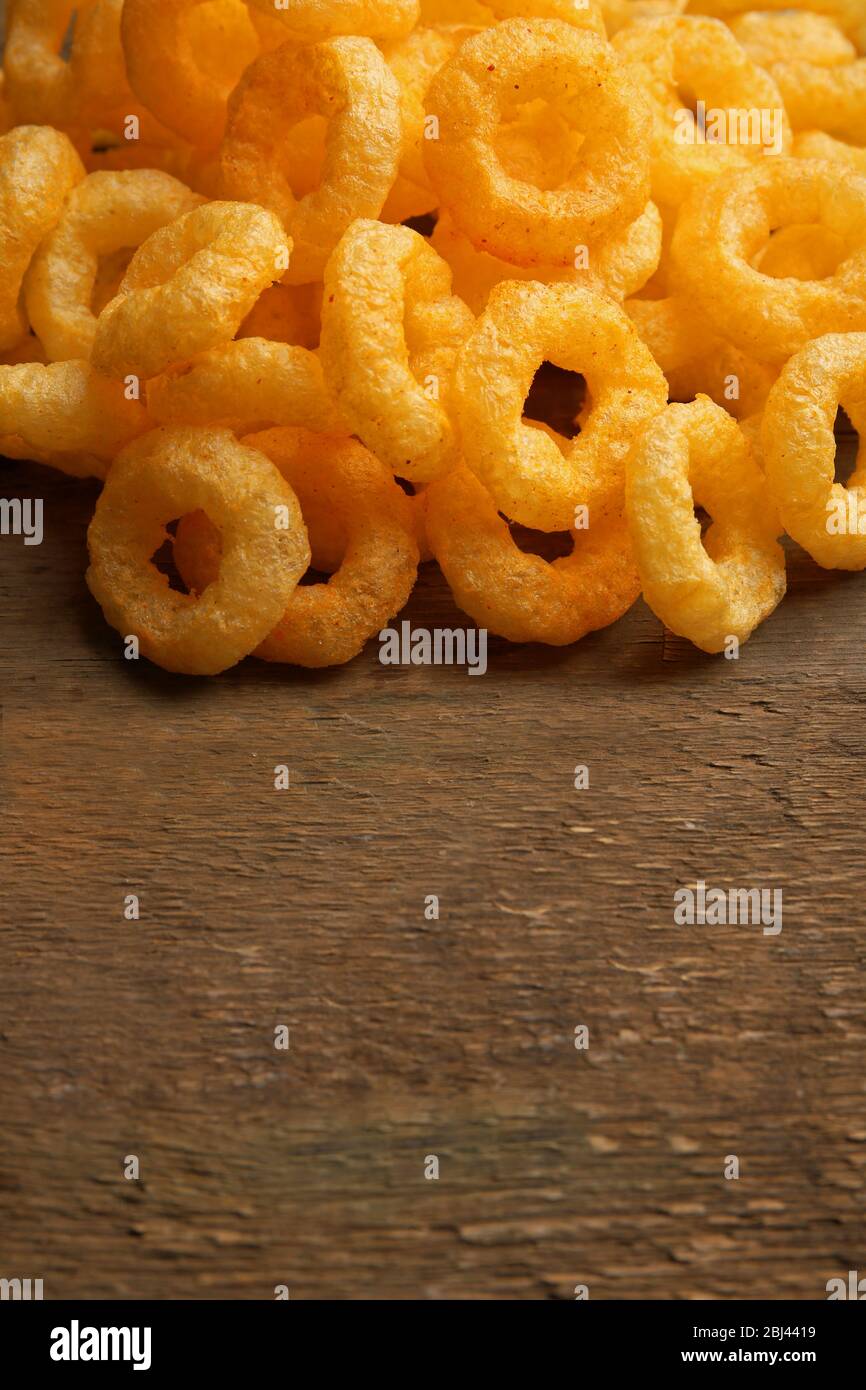 Chips rings on wooden background Stock Photo - Alamy