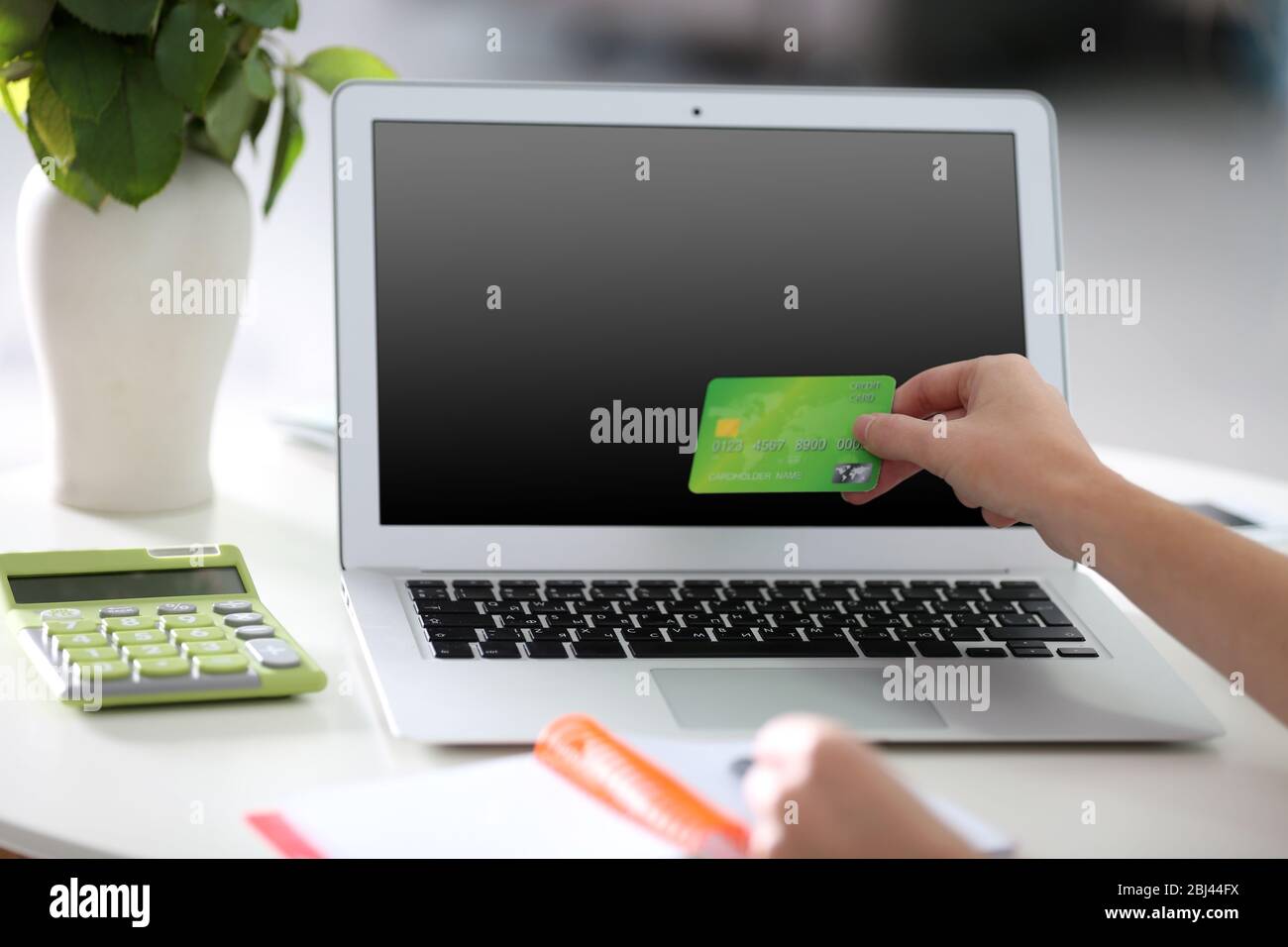 Female making online payment hi-res stock photography and images - Alamy