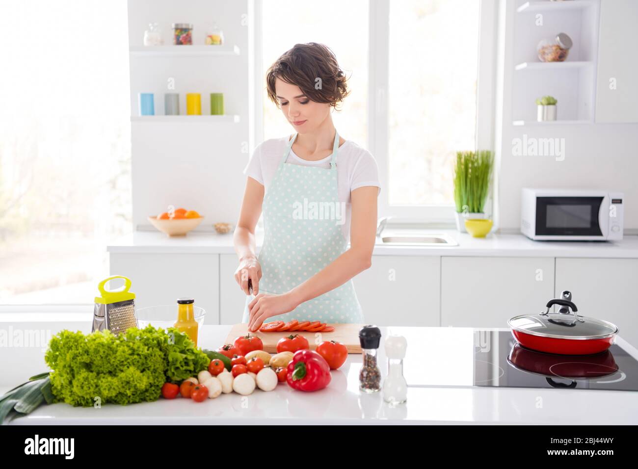 Photo of housewife attractive focused chef lady arms holding tomato ...