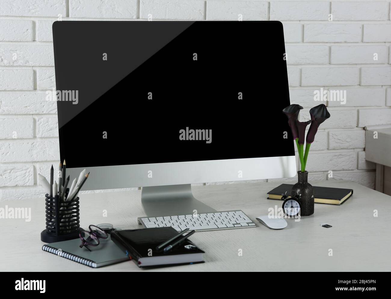 Stylish workplace with computer in home or office Stock Photo - Alamy