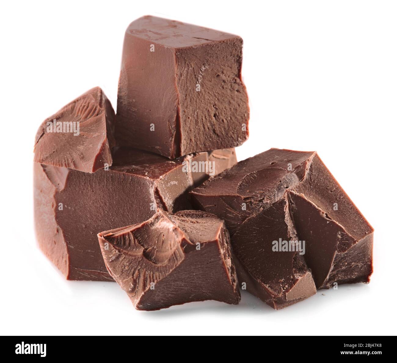 Milk chocolate pieces isolated on white Stock Photo - Alamy