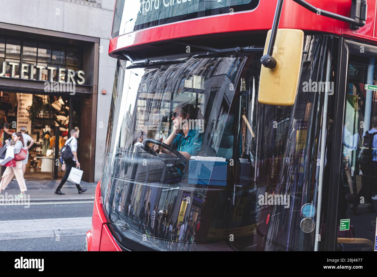 London/UK-24/07/18: female bus driver in a cabin of a double decker ...