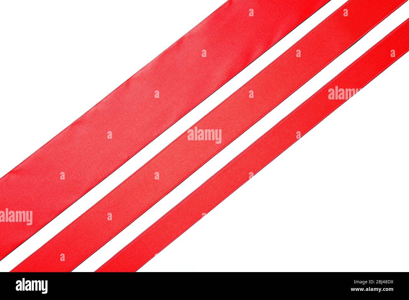 three red diagonal ribbons, isolated on white Stock Photo - Alamy