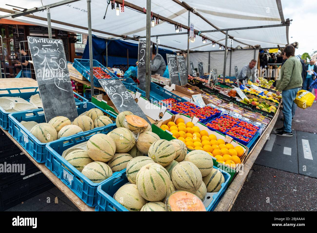 Amsterdam, Netherlands - September 8, 2018: Vendor in a fruit and ...