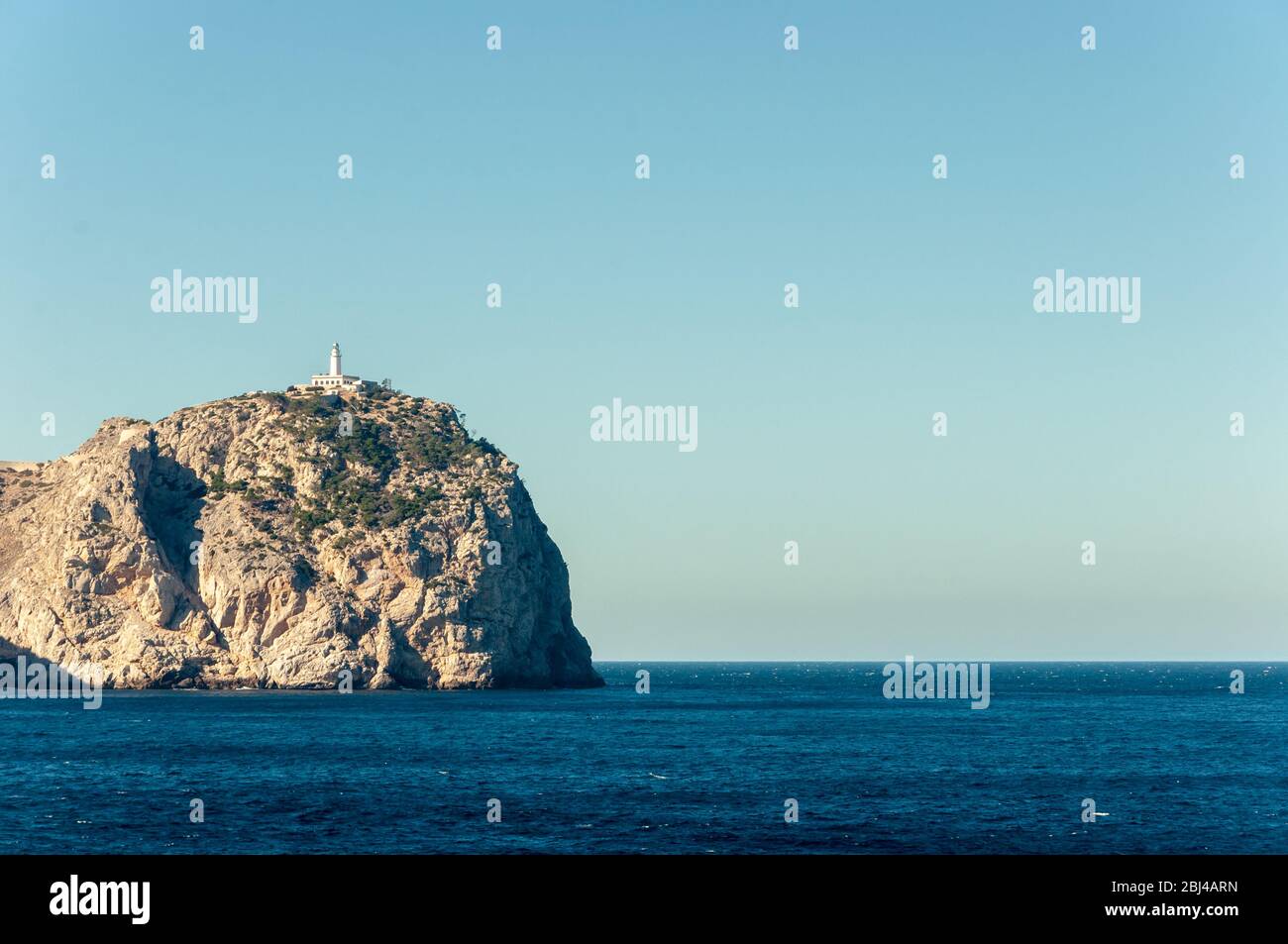 Formentor lighthouse seen from the high seas. Tramuntana mountains ...