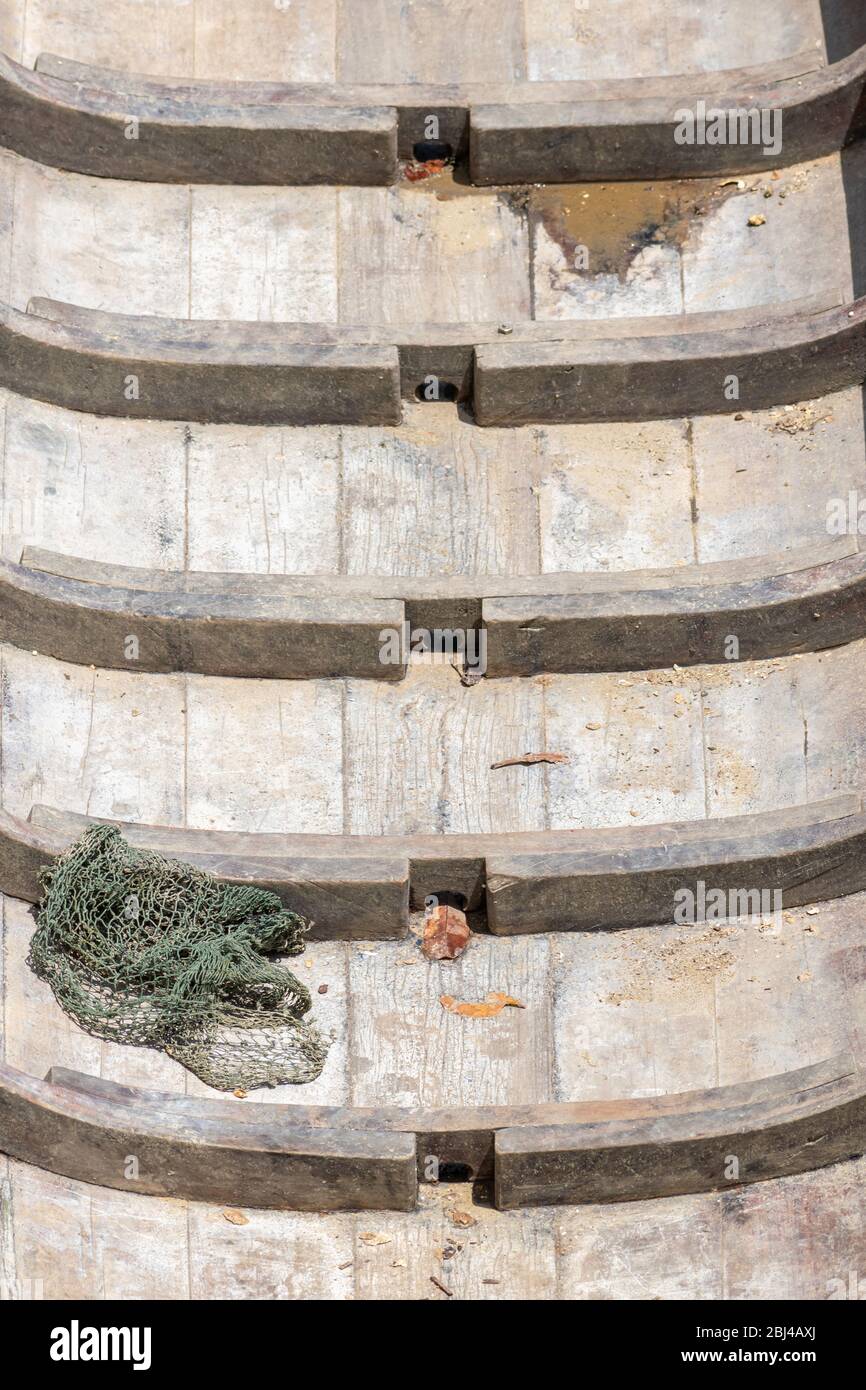 Old wooden fishing boat deck with green old fishing net background with ...