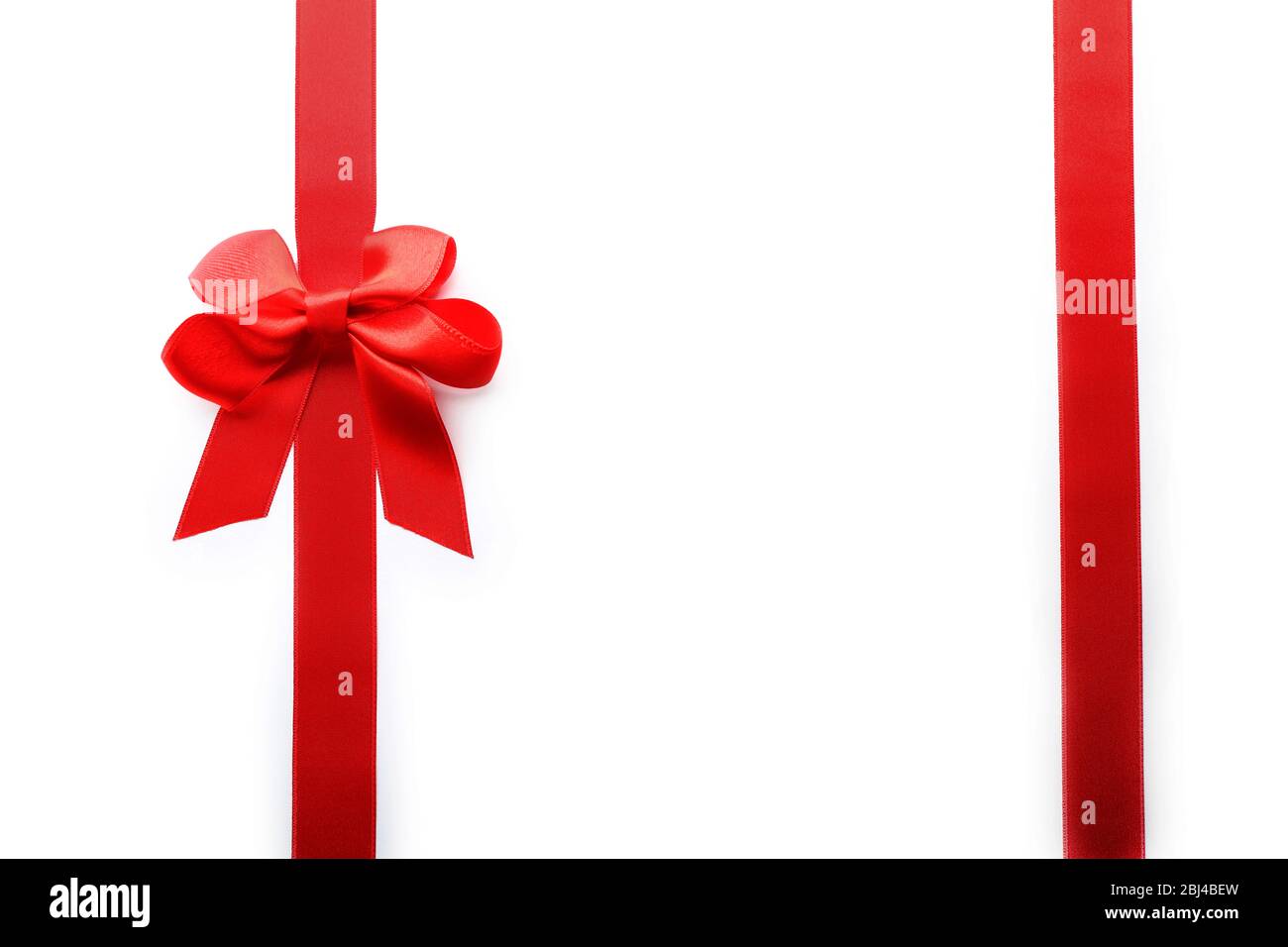 Two ribbons and bow, isolated on white Stock Photo - Alamy