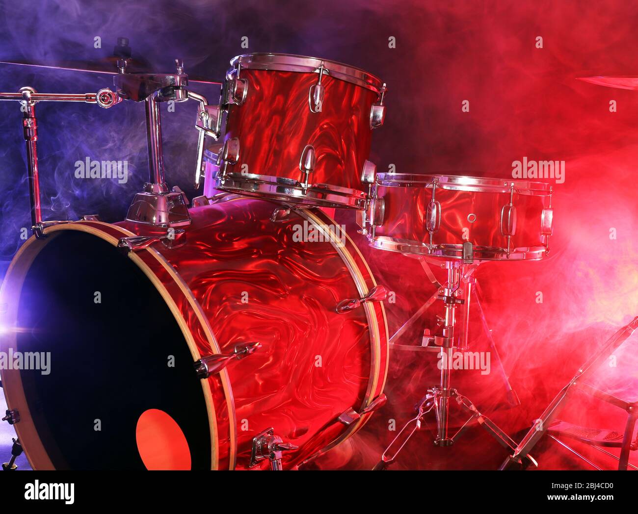 Drum set in smoke on a stage Stock Photo - Alamy