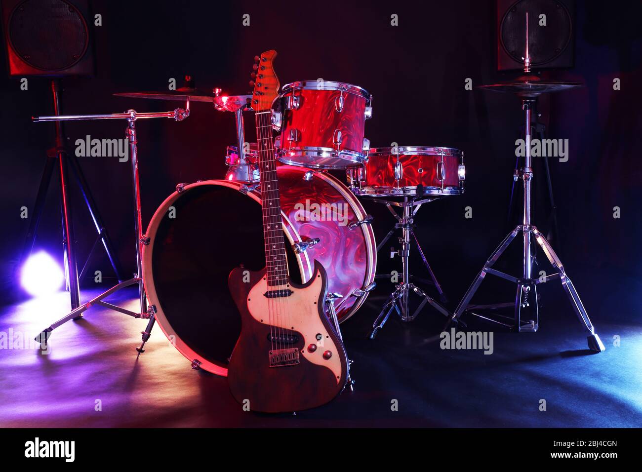 Musical instruments on a stage on dark background Stock Photo - Alamy