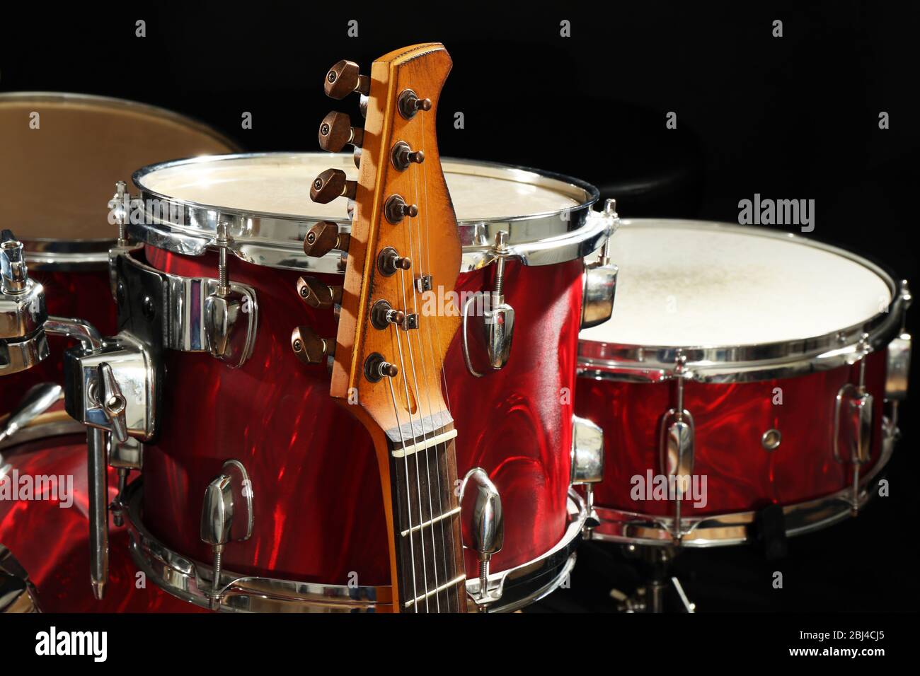 Musical instruments on a stage on dark background Stock Photo - Alamy
