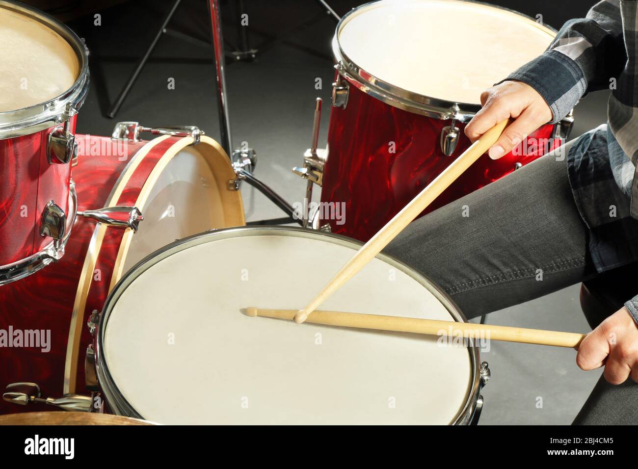 Drummer playing the drums closeup Stock Photo - Alamy