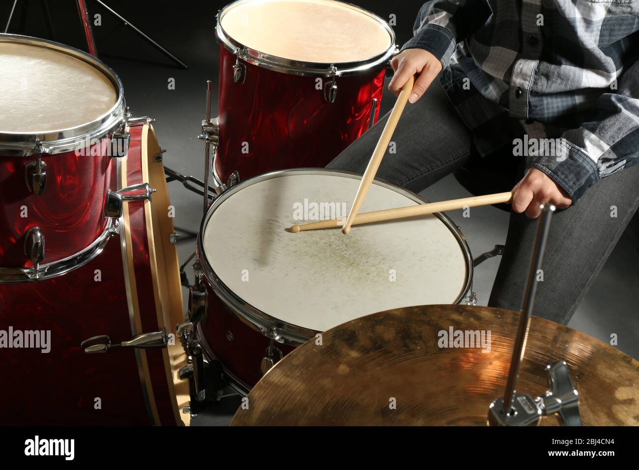 Drummer playing the drums closeup Stock Photo - Alamy