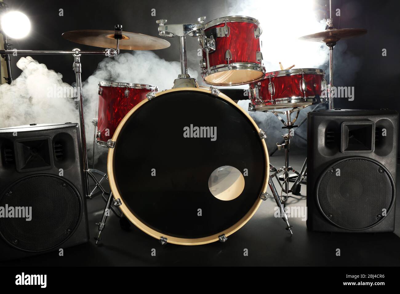 Drum set in smoke on a stage Stock Photo - Alamy