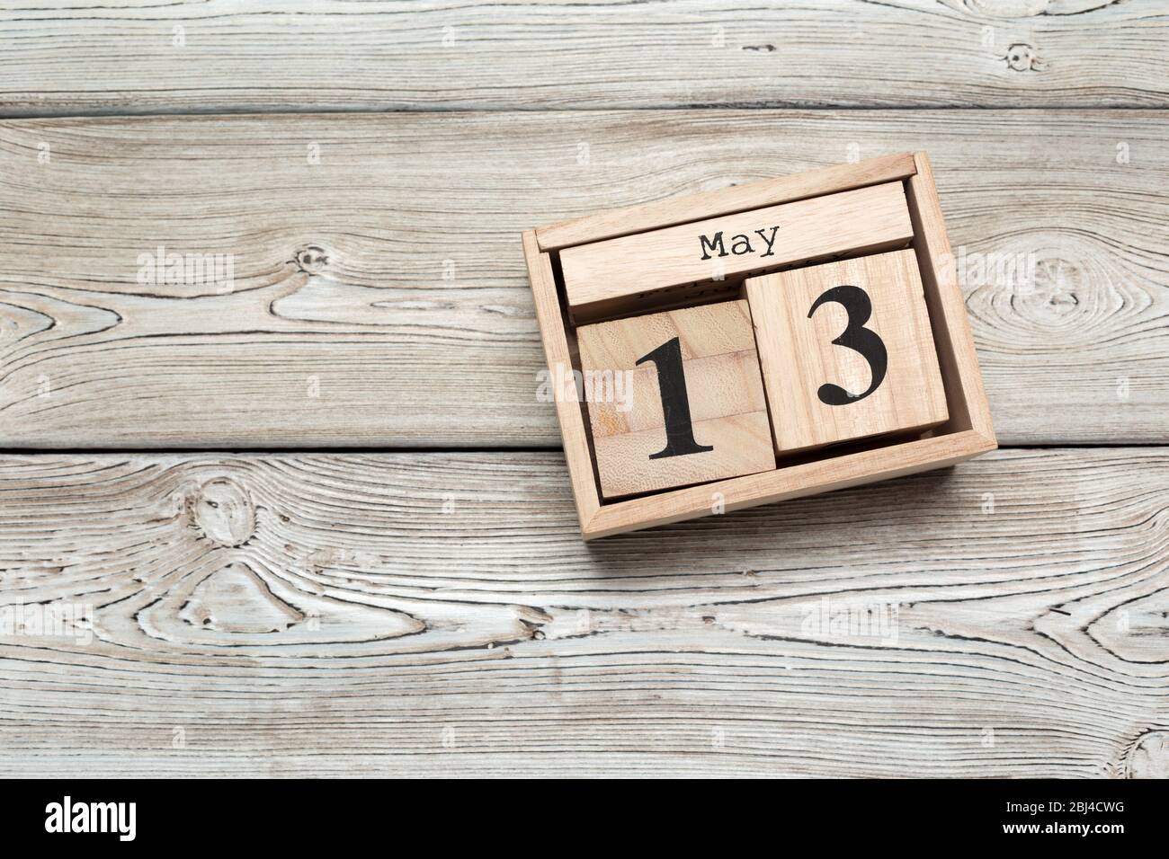 cube calendar for may 13th on wood with copy space Stock Photo - Alamy