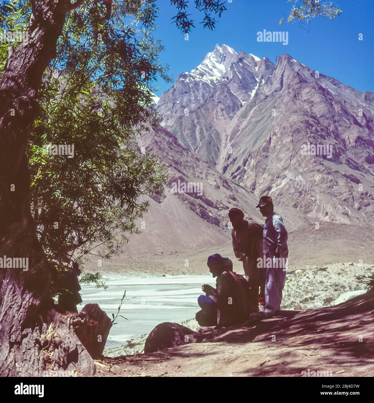 Pakistan, Northern Areas of the Karakoram Mountains. Balti porters take ...
