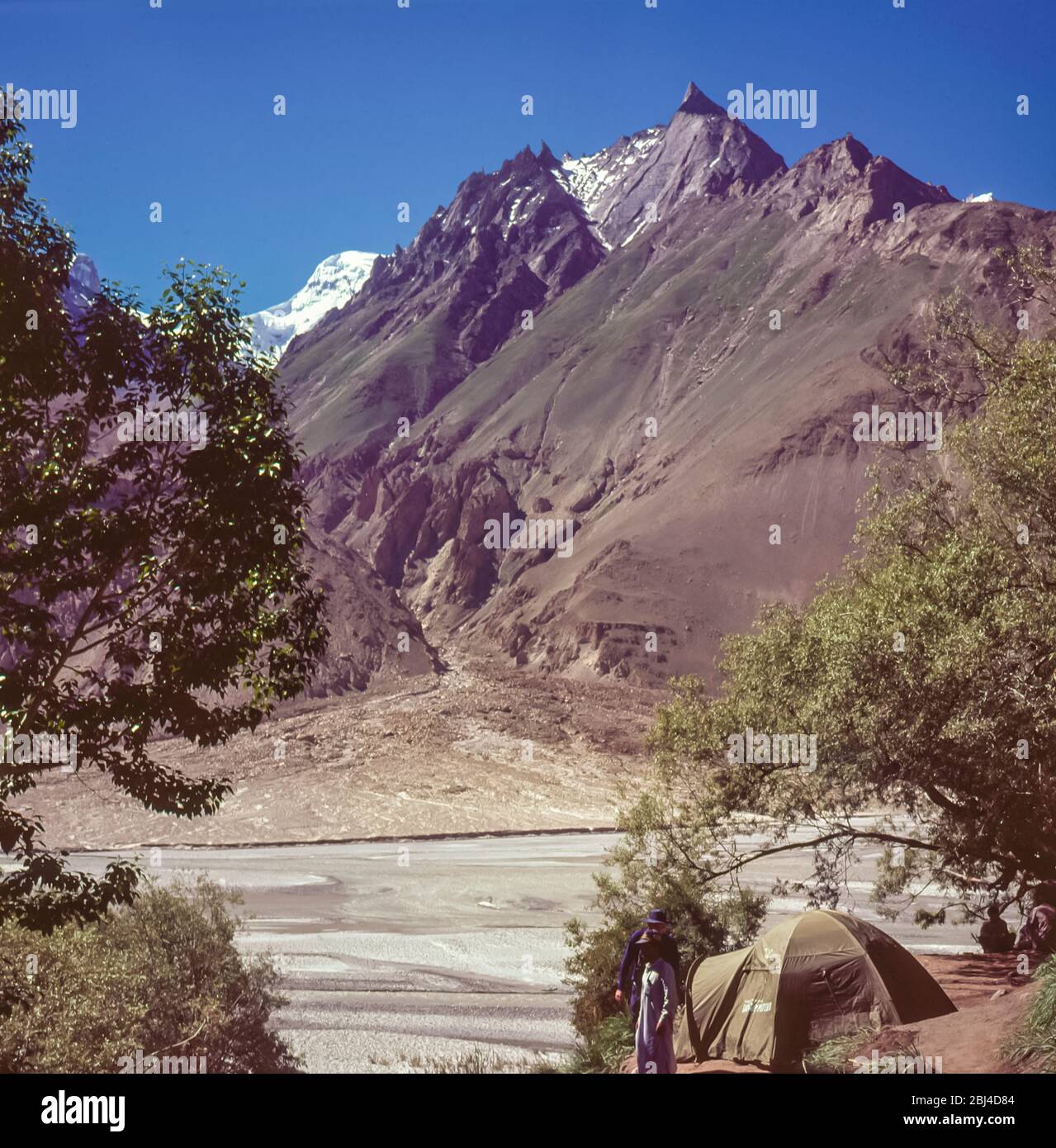 Pakistan, Northern Areas of the Karakoram Mountains. Balti porters take ...