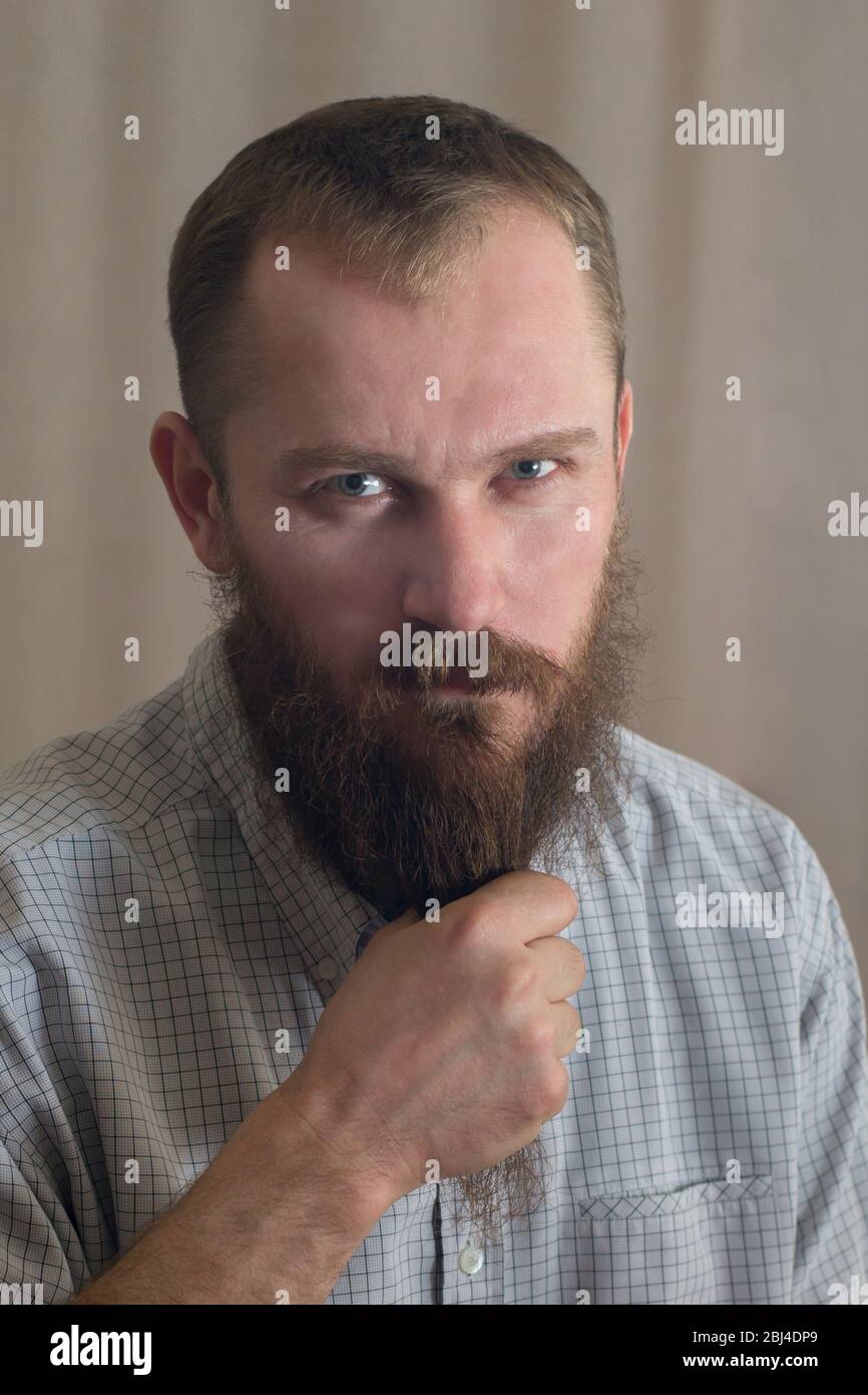 Angry man and long white beard hi-res stock photography and images - Alamy