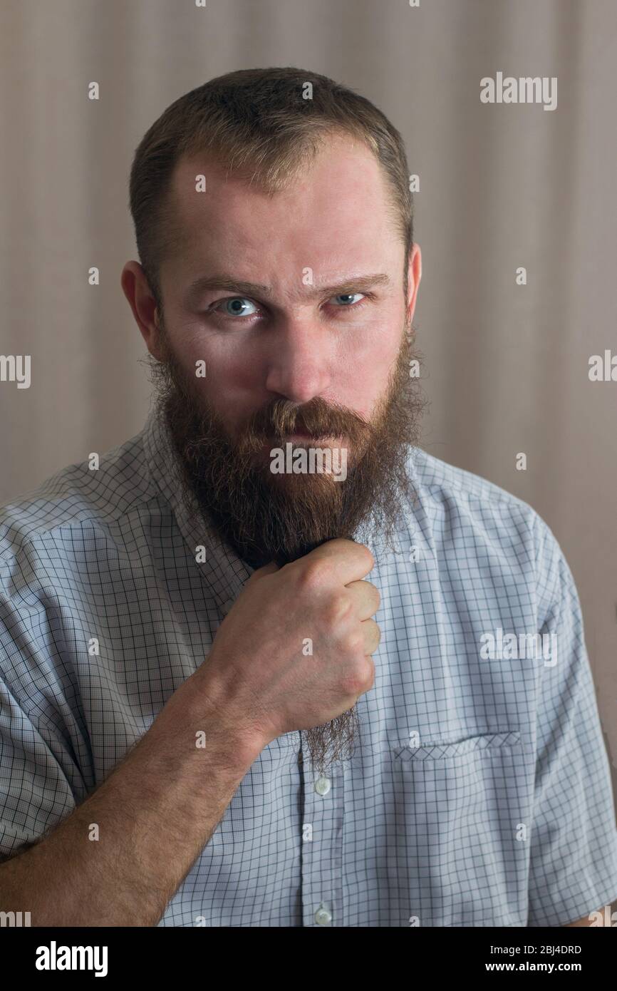 Angry man and long white beard hi-res stock photography and images - Alamy