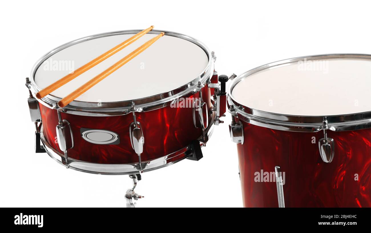 Red drums with drum sticks isolated on white background Stock Photo - Alamy