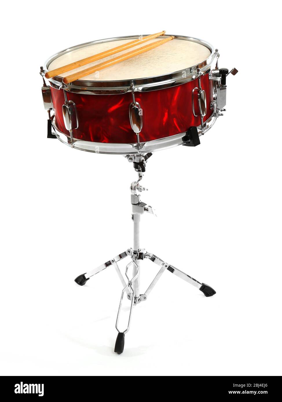 Red drum with drum sticks isolated on white background Stock Photo - Alamy