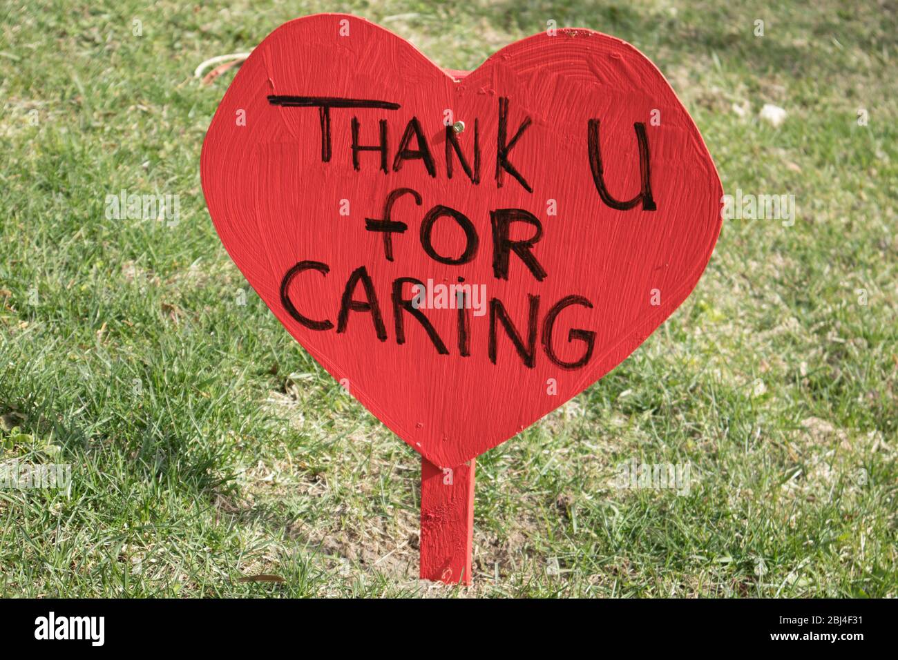As a sign of appreciation and thanks, a red heart is planted in front ...