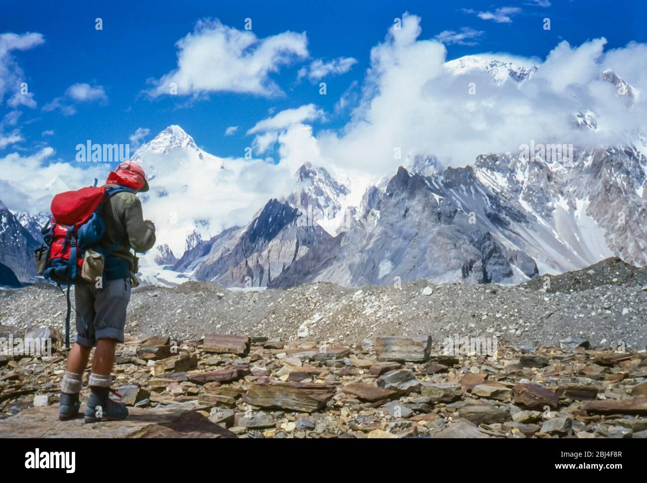 Pakistan, Northern Areas of the Karakoram Mountains. A lone trekker ...