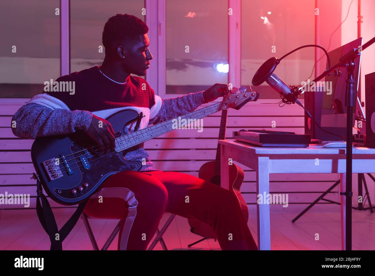 Create music and a recording studio concept - Black man guitarist ...