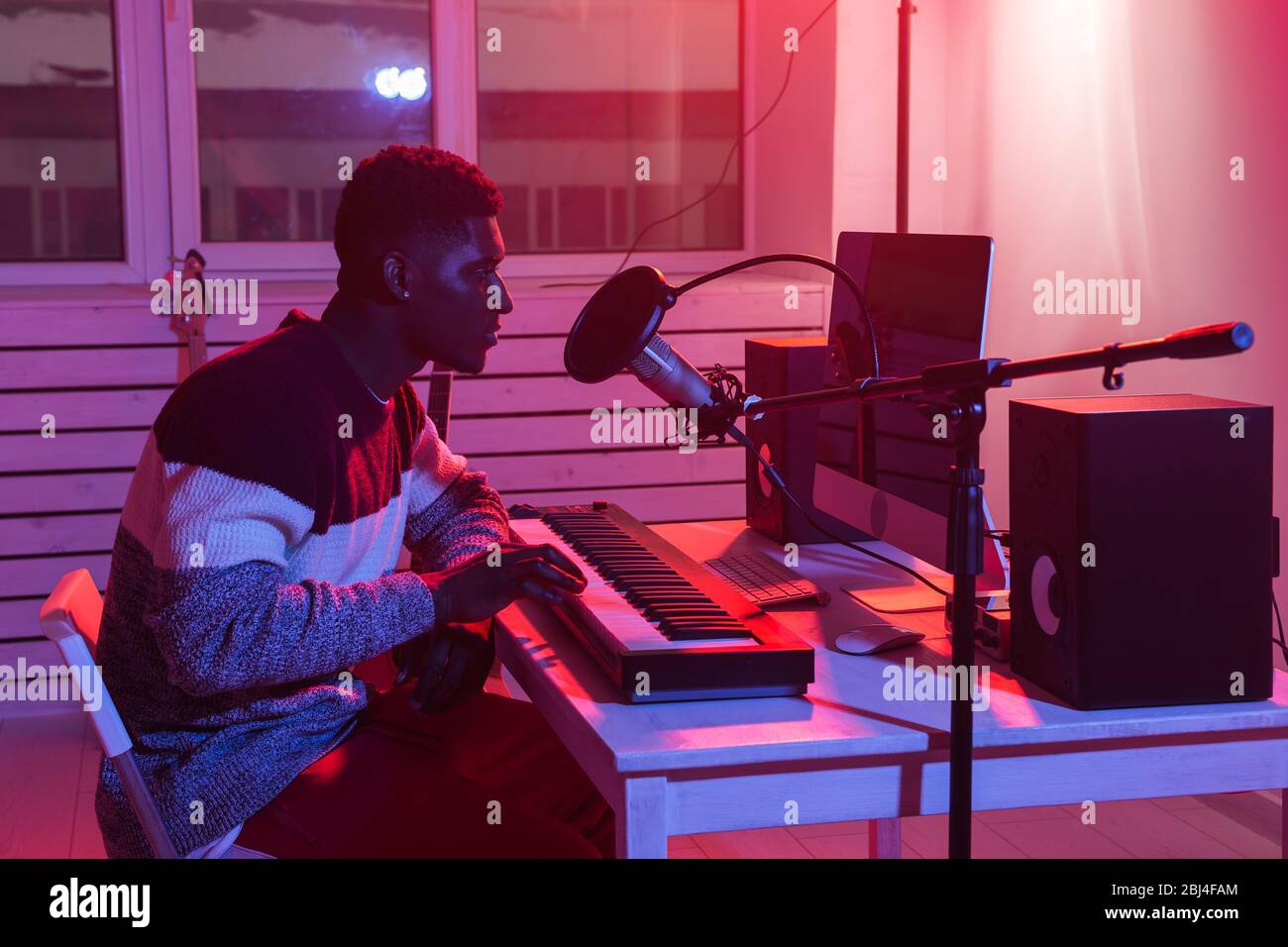 Music production concept - Male sound producer working in home ...