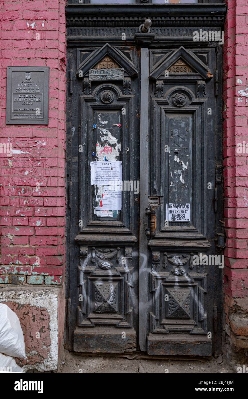 Entrance to abandoned historic building with old wooden door of ornate ...
