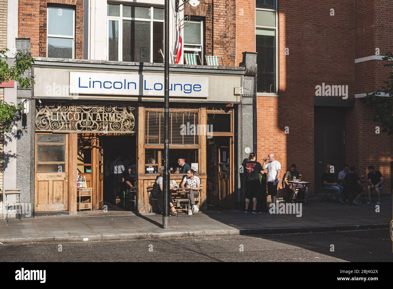 London/UK-26/07/18: people sitting at the tables just outside the ...