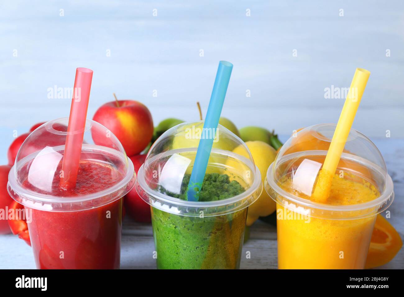 Fresh juice mix fruit, healthy drinks on color wooden background Stock ...