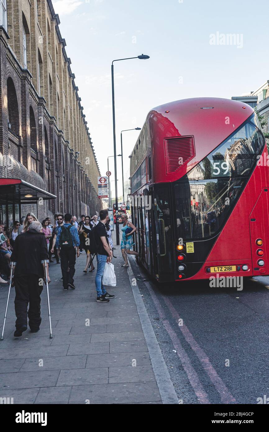 London/UK-26/07/18: people getting off the red double-decker bus at ...