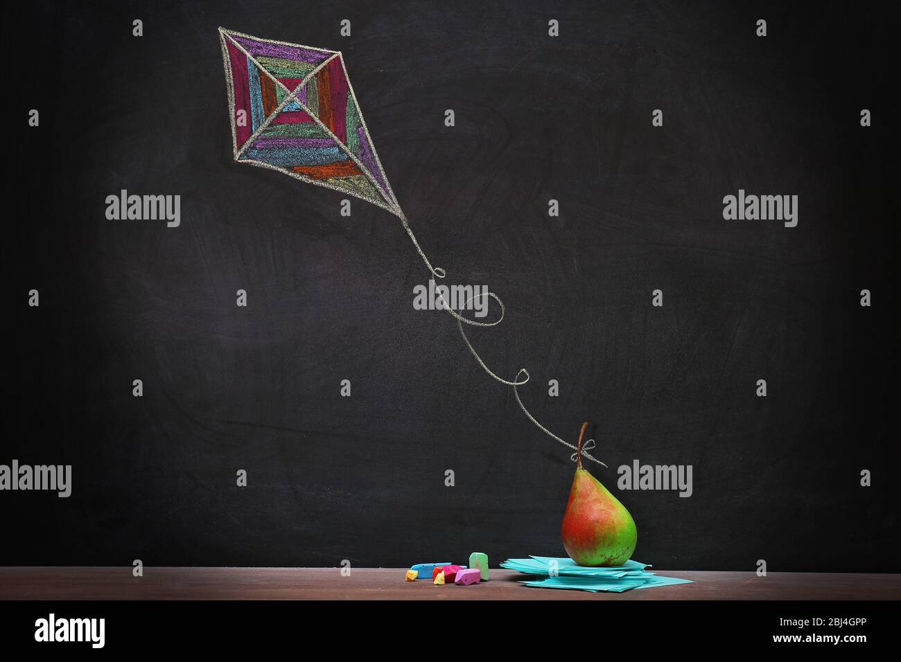 Funny composition of office supplies and pictures drawn with chalk on ...