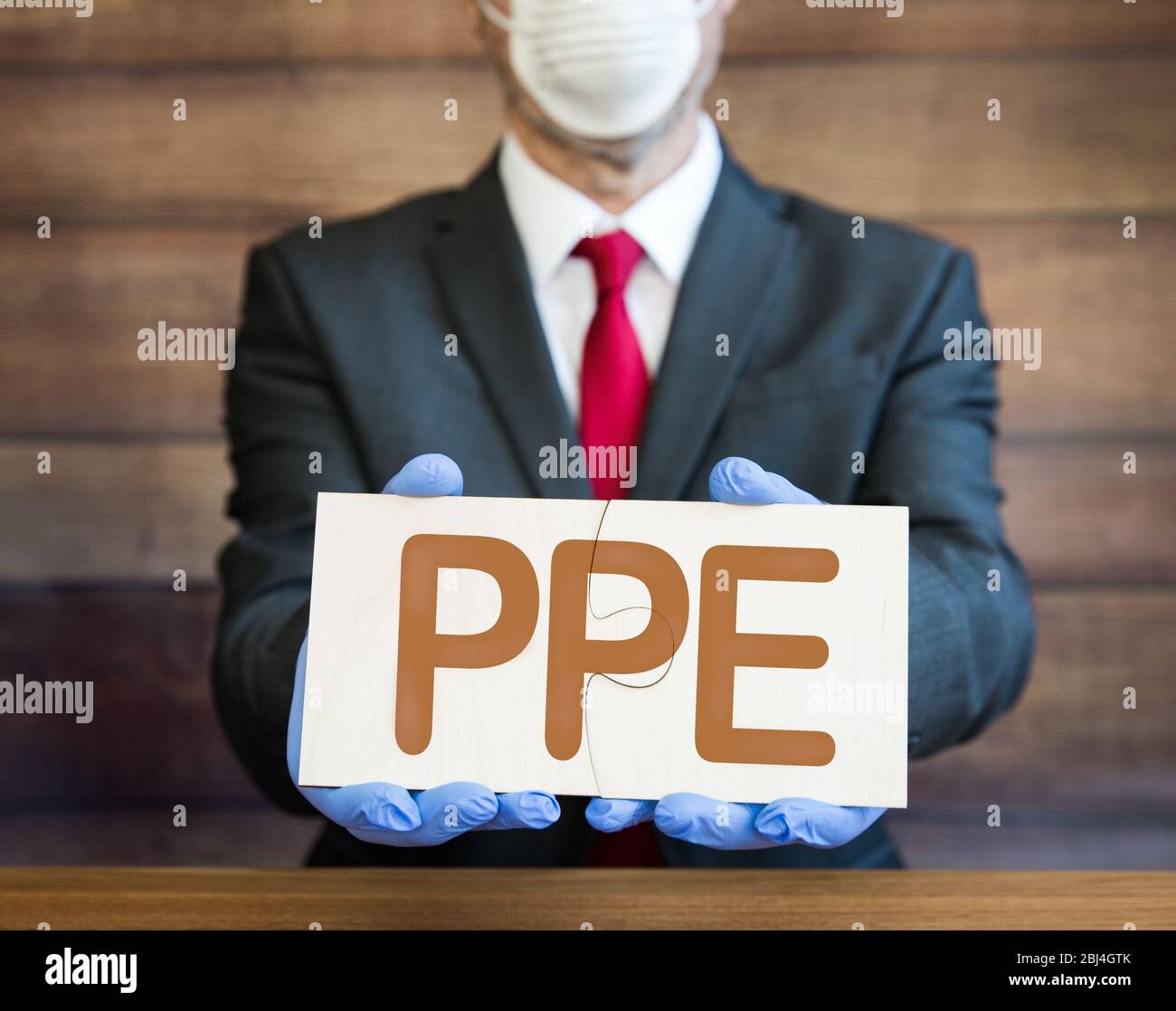 A PPE Concept of a businessman, Doctor or employer wearing blue ...