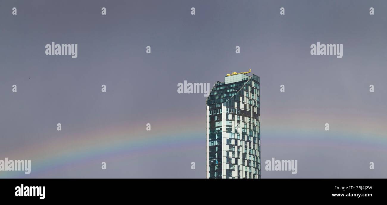 A rainbow seen either side of the West Tower Building in Liverpool ...