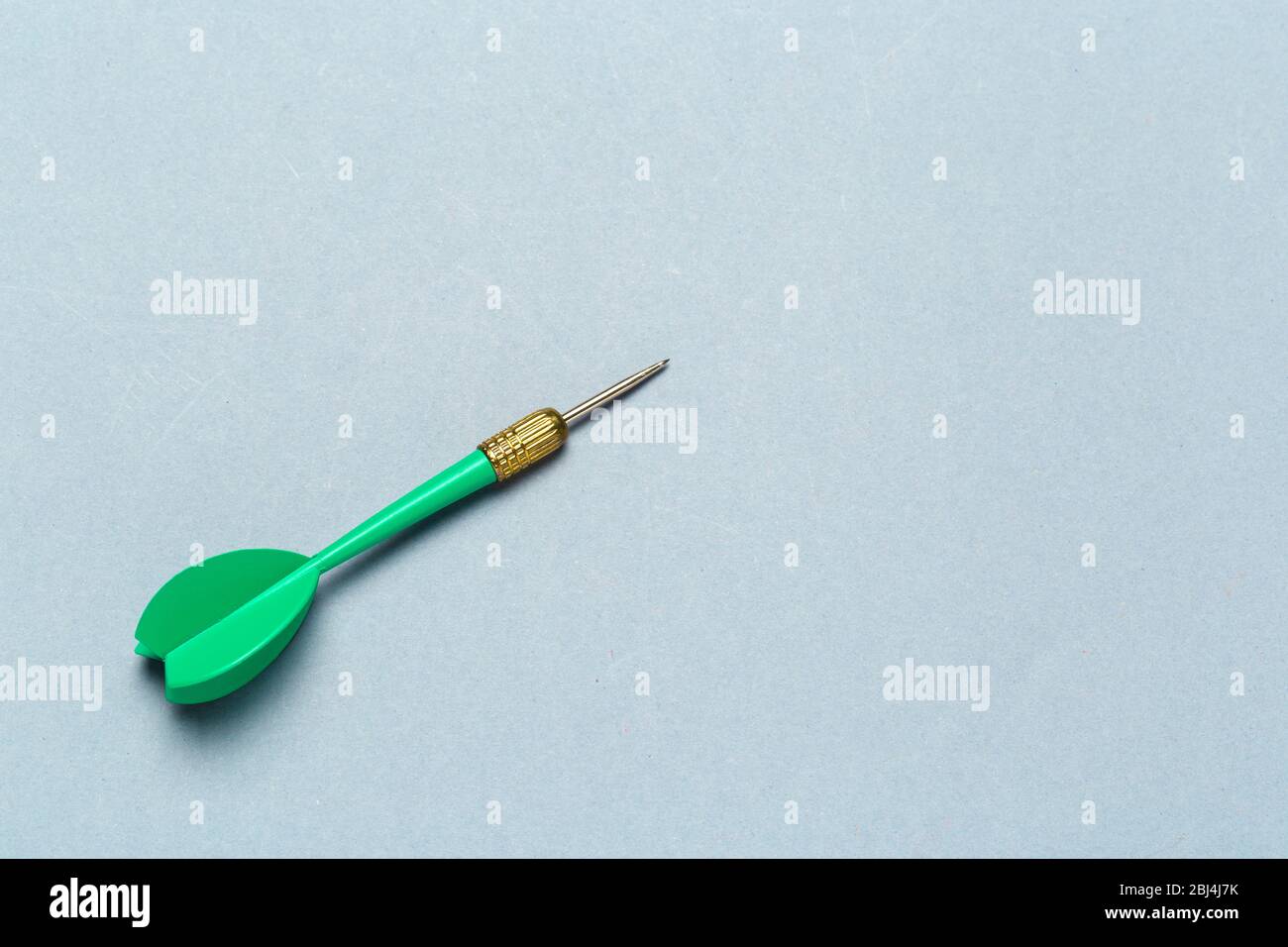 One single dart arrow on light gray background Stock Photo - Alamy