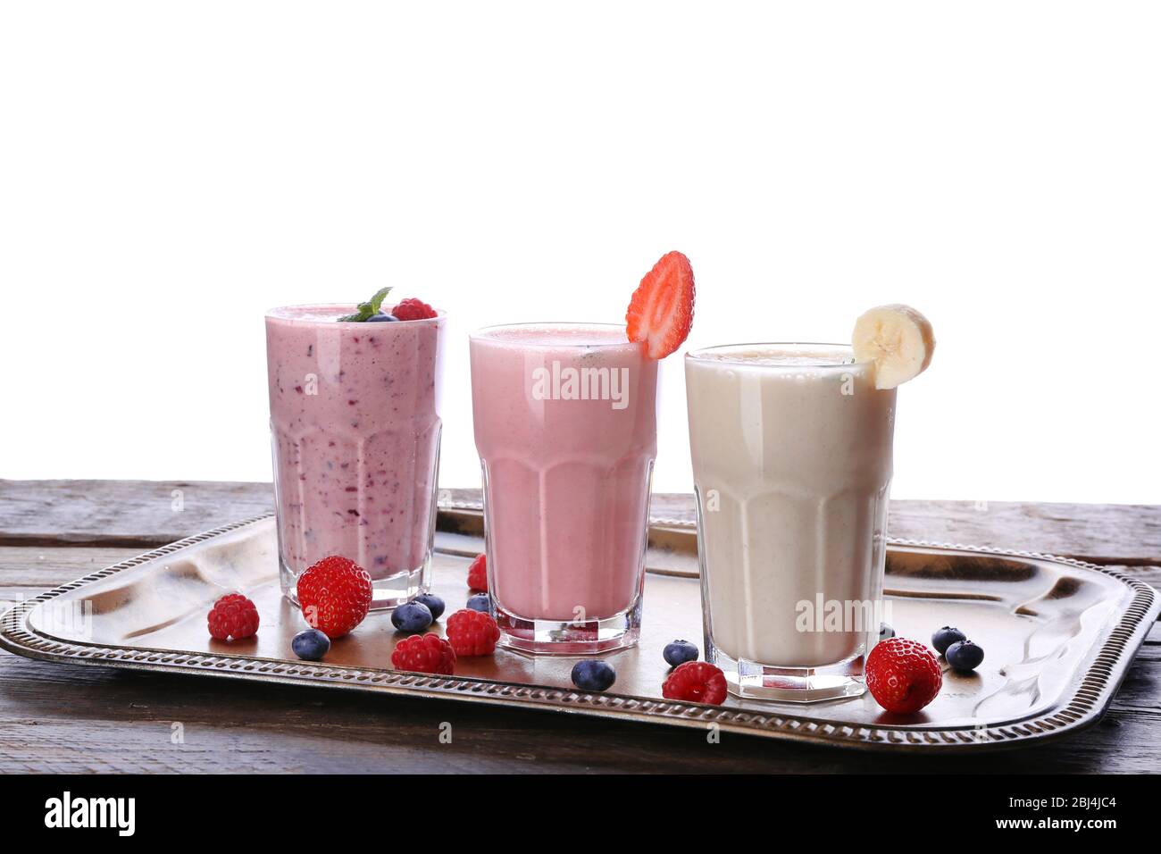 Milk shakes on white background Stock Photo - Alamy