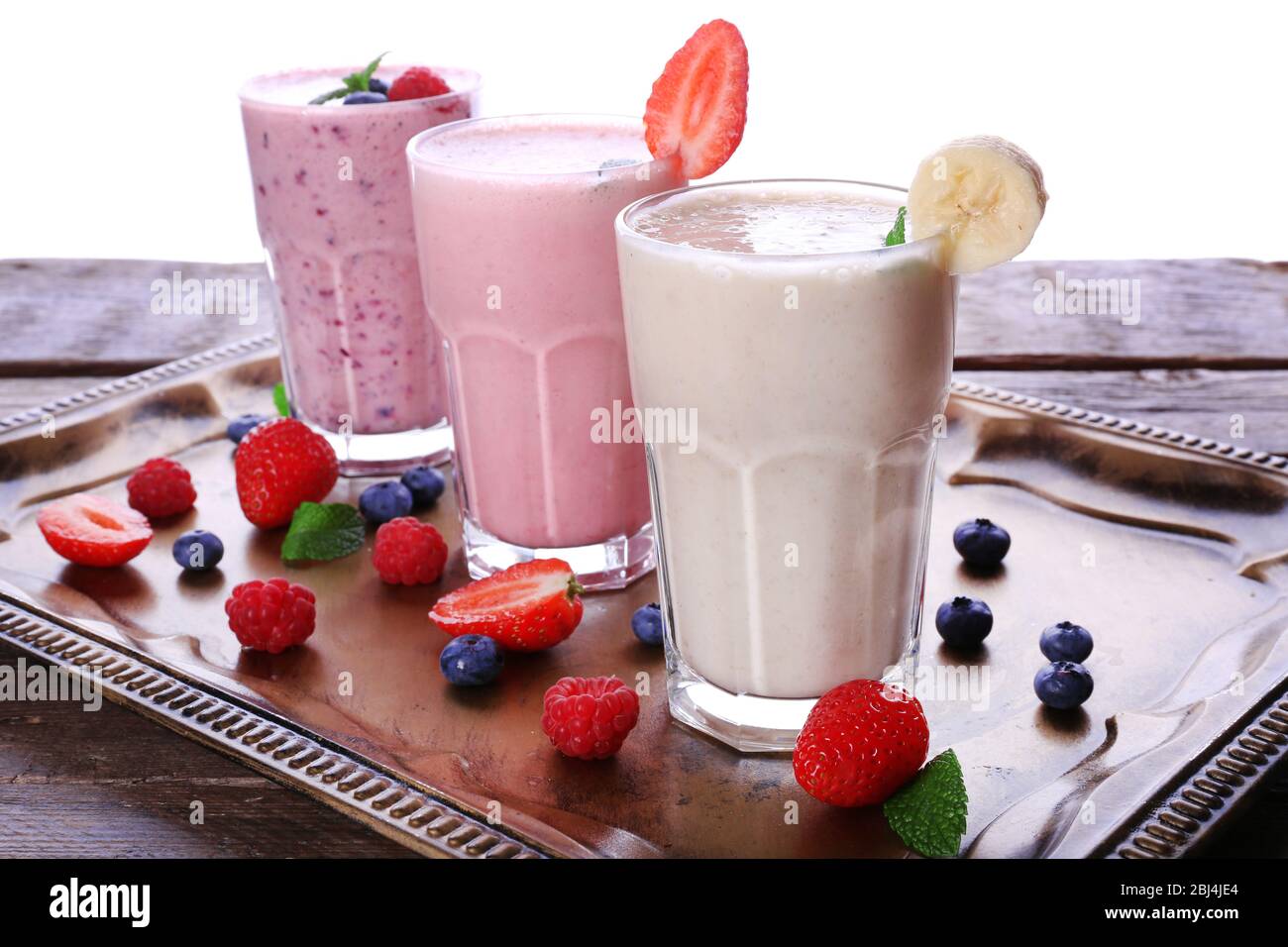 Milk shakes on white background Stock Photo - Alamy