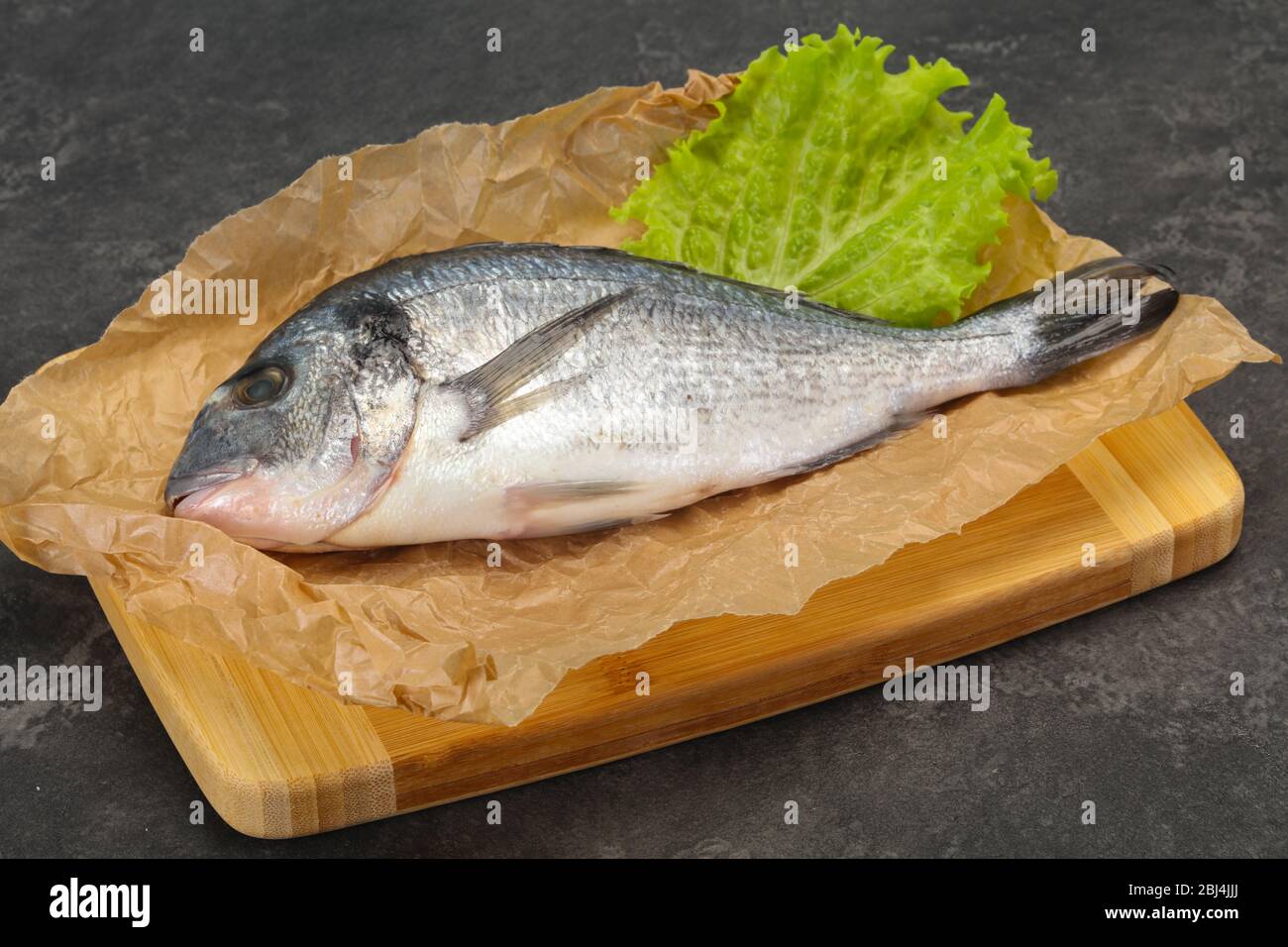Raw Dorada fish ready for cooking Stock Photo - Alamy